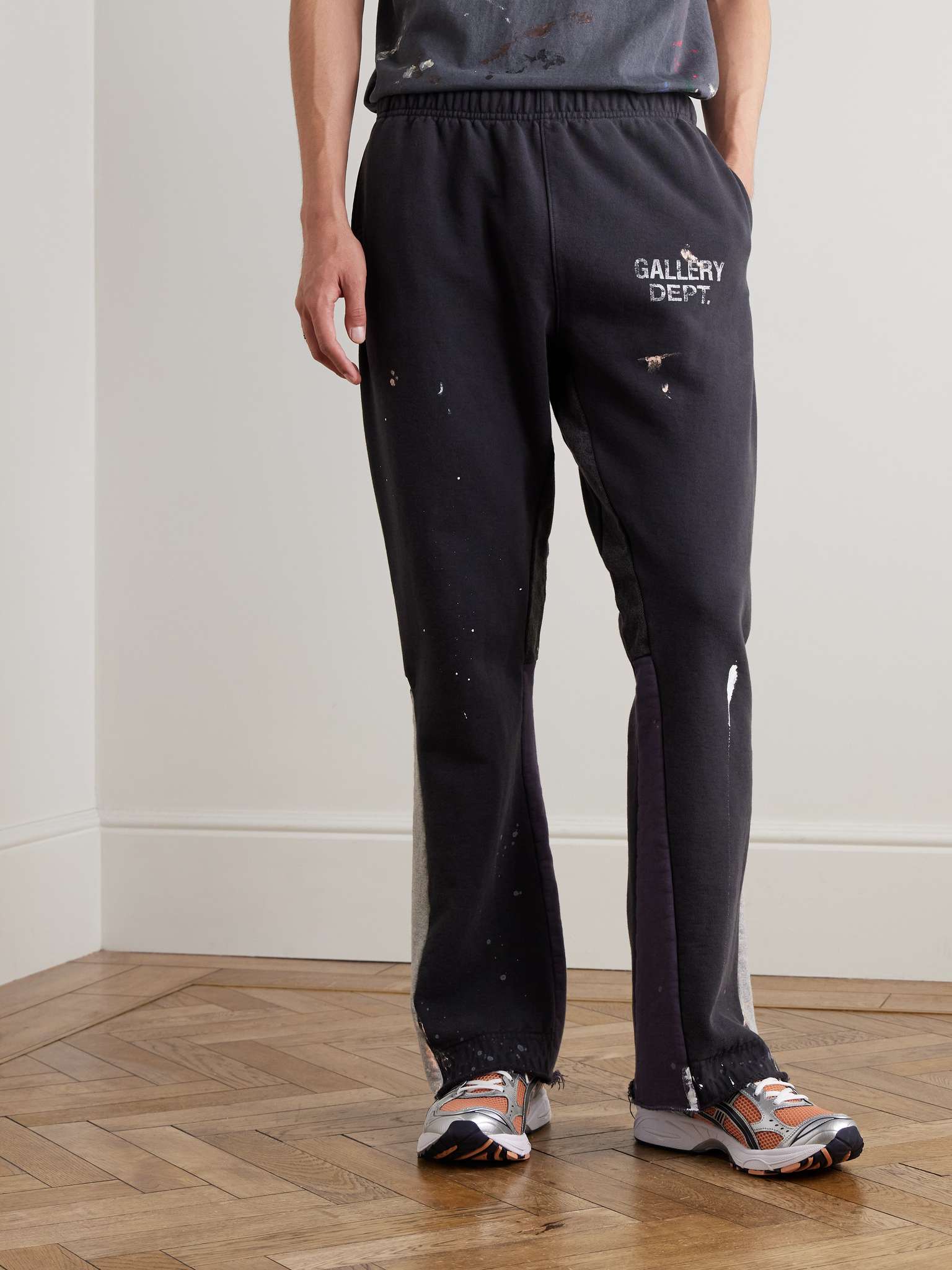 GALLERY DEPT. Flared Paint-Splattered Panelled Logo-Print Cotton-Jersey ...