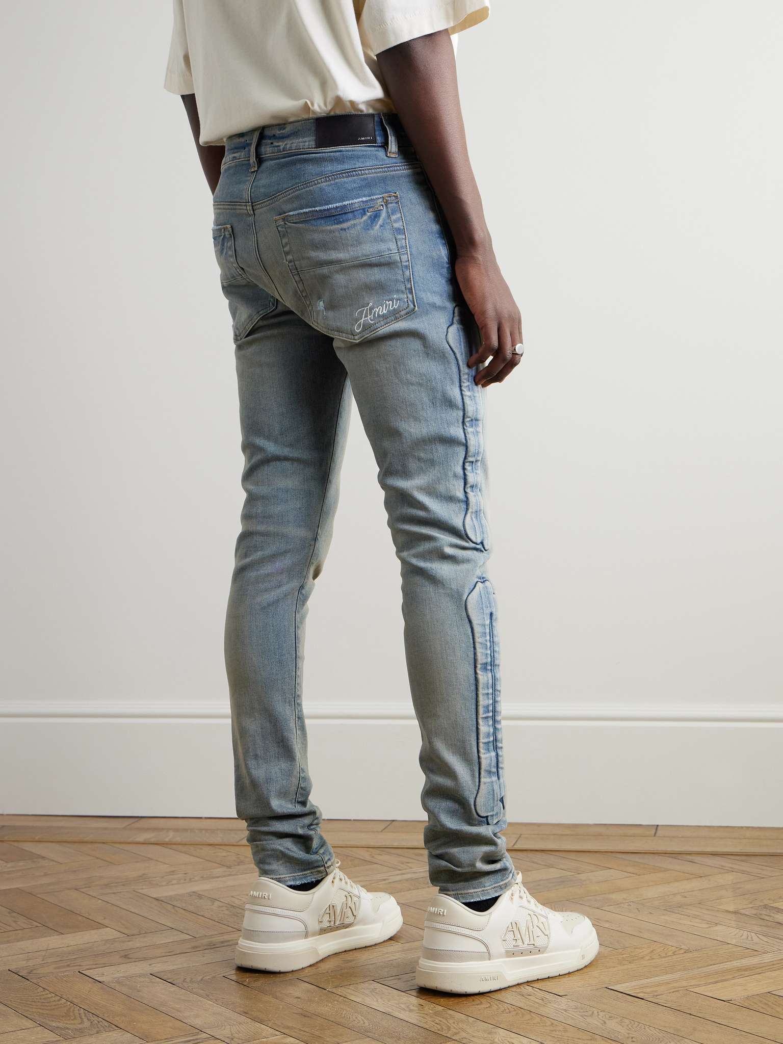 AMIRI 3D Bones Skinny-Fit Distressed Appliquéd Jeans for Men | MR PORTER
